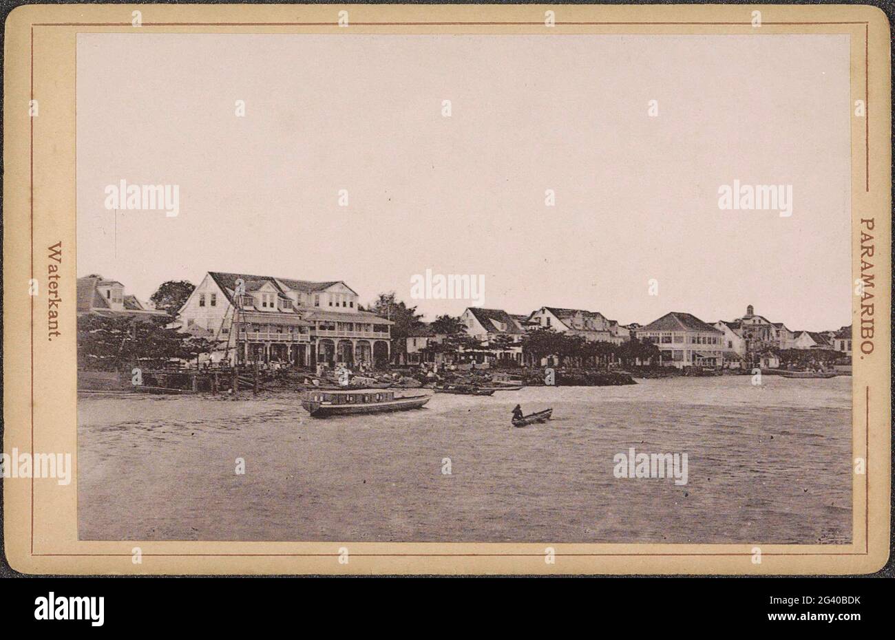 View of the waterfront in Paramaribo with houses and boats; Paramaribo ...