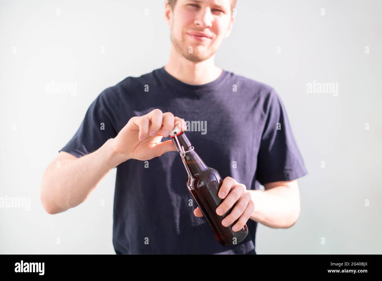 man open the glass beer bottle on party, bad habit, alcohol addict ...