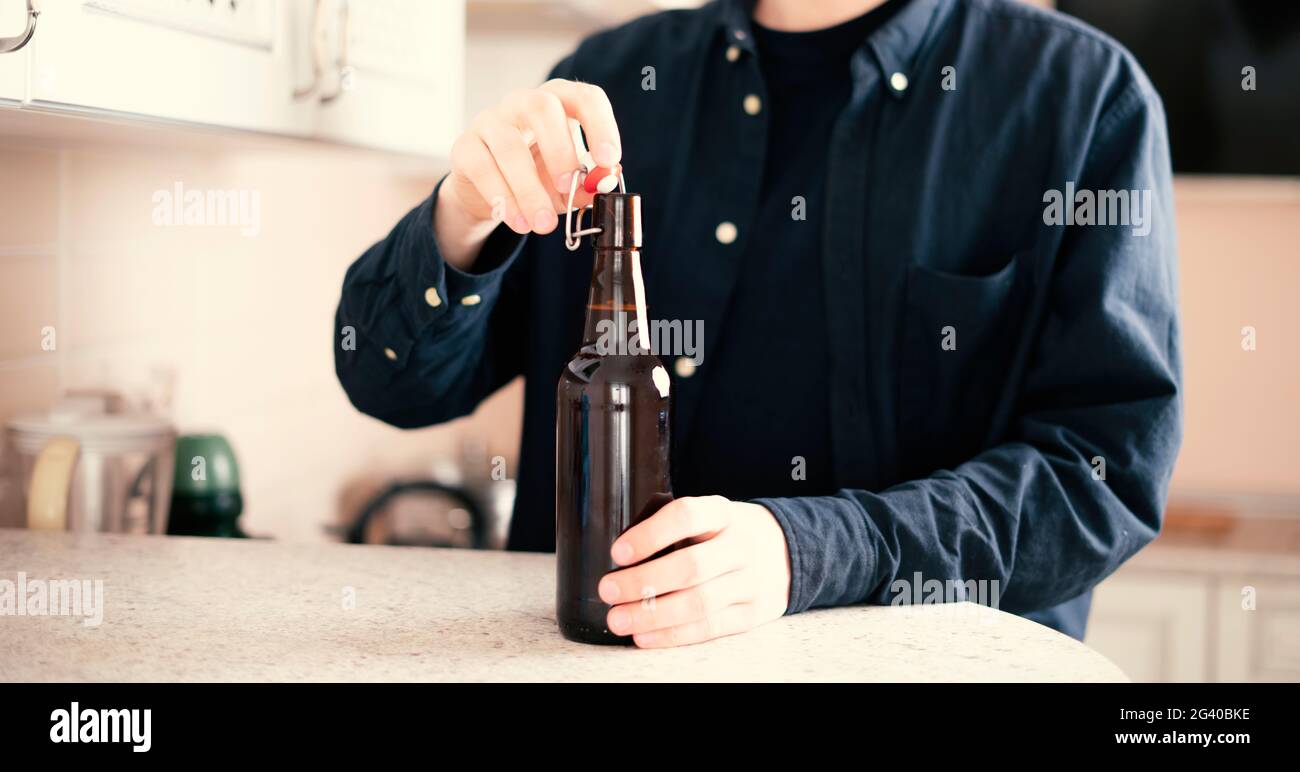 Man opening beer bottle hi-res stock photography and images - Alamy