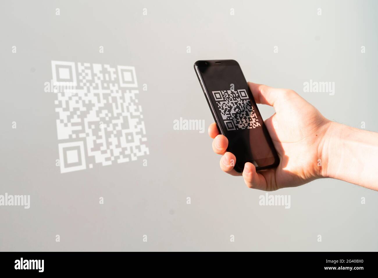 hand holding a smartphone and scan the qr code to make a payment Stock ...