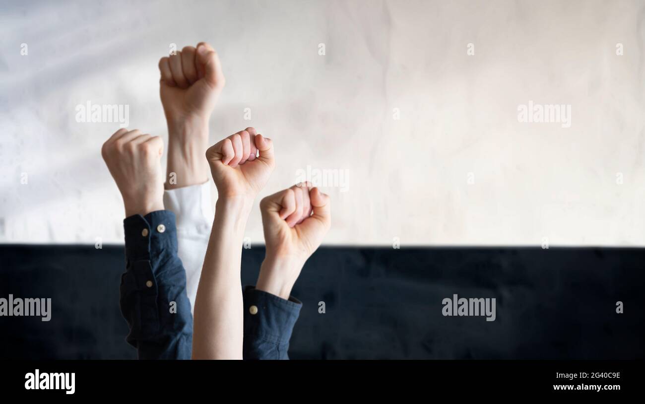 people with raised hands fists in the air, as symbol of protest for ...