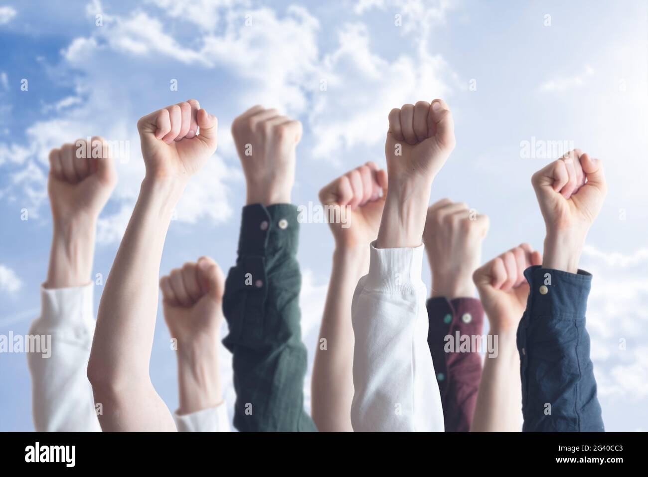 people with raised hands fists in the air, as symbol of protest for ...