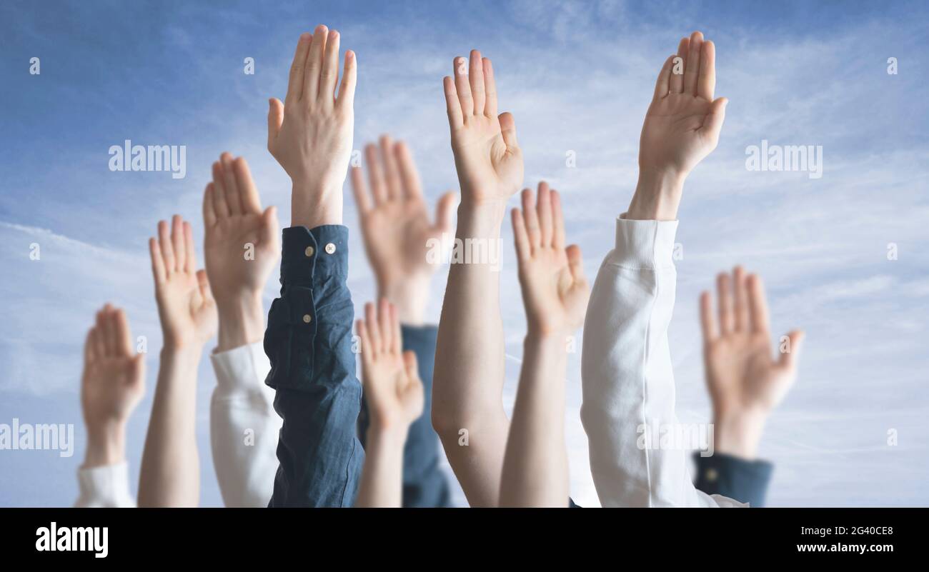 people hands raised in the air, vote, election, democracy Stock Photo ...