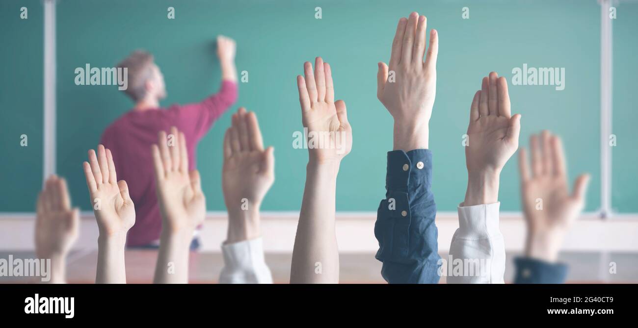 students at school with raised hands? classroom learning together Stock ...