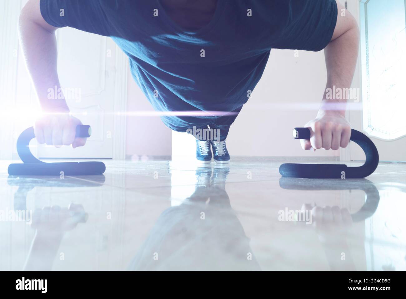 male person doing push-ups on the floor, making body fit, healthy ...