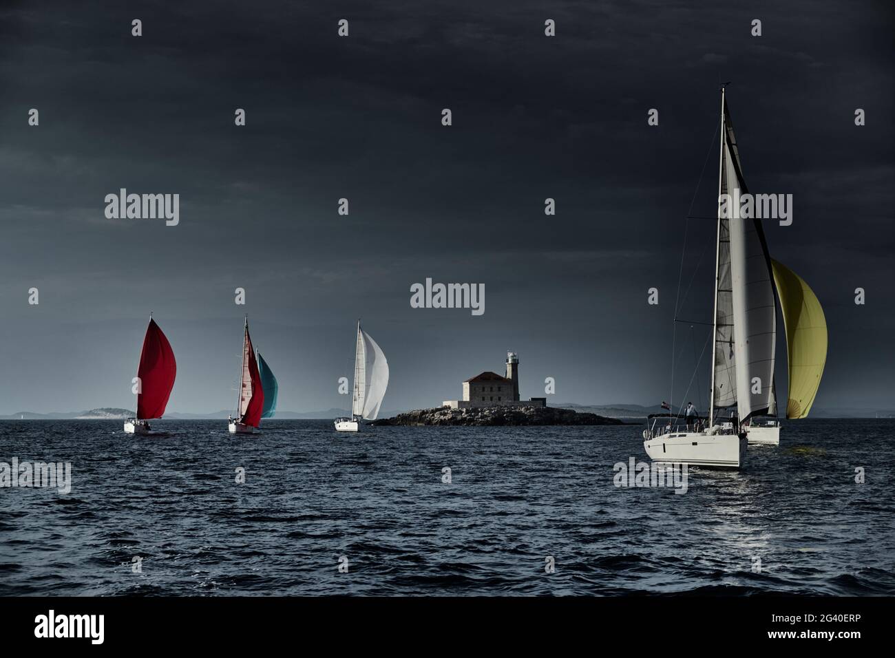 Sailboats compete in a sail regatta at sunset, race of sailboats ...