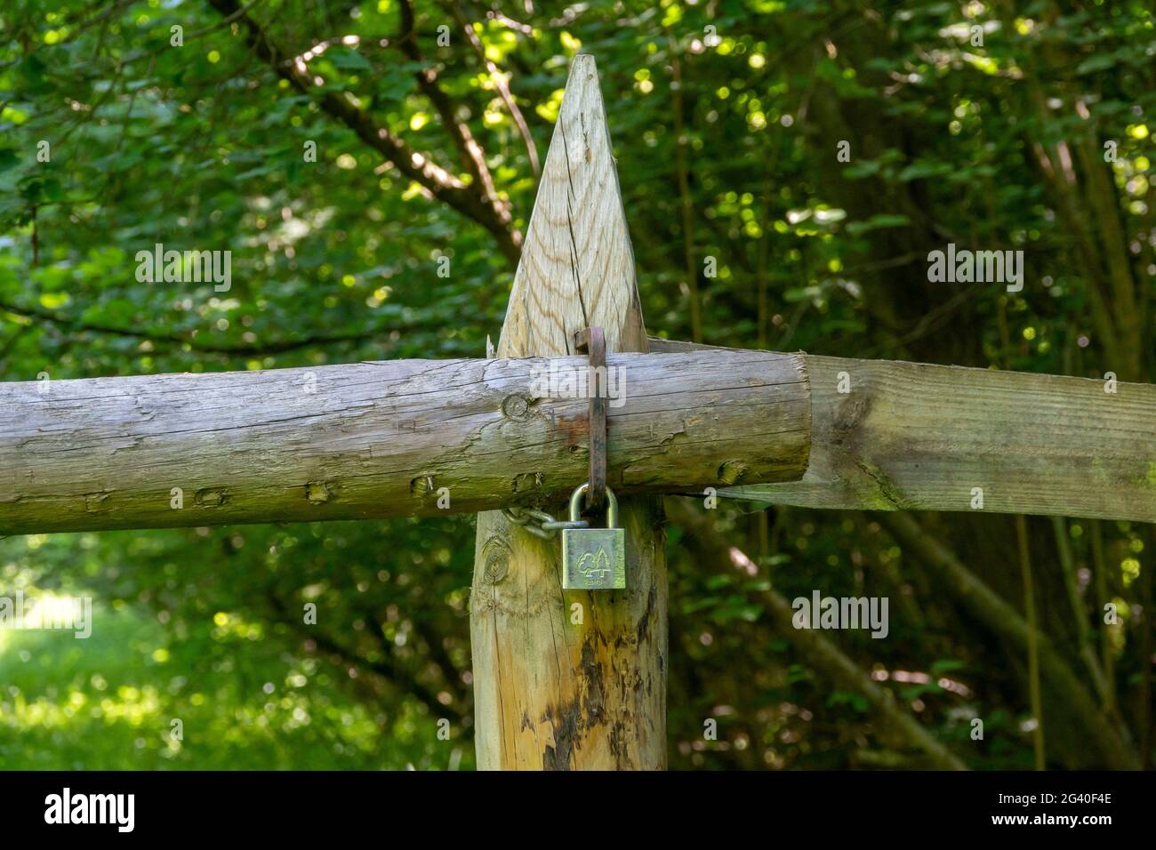 Small padlock on a vehicle access wooden forest gate Stock Photo - Alamy