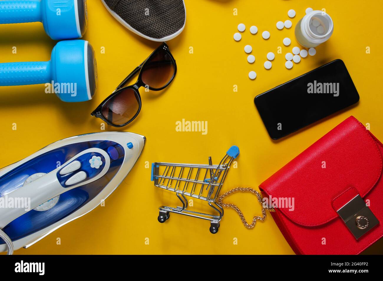 Many different objects on a yellow background. Top view Stock Photo - Alamy