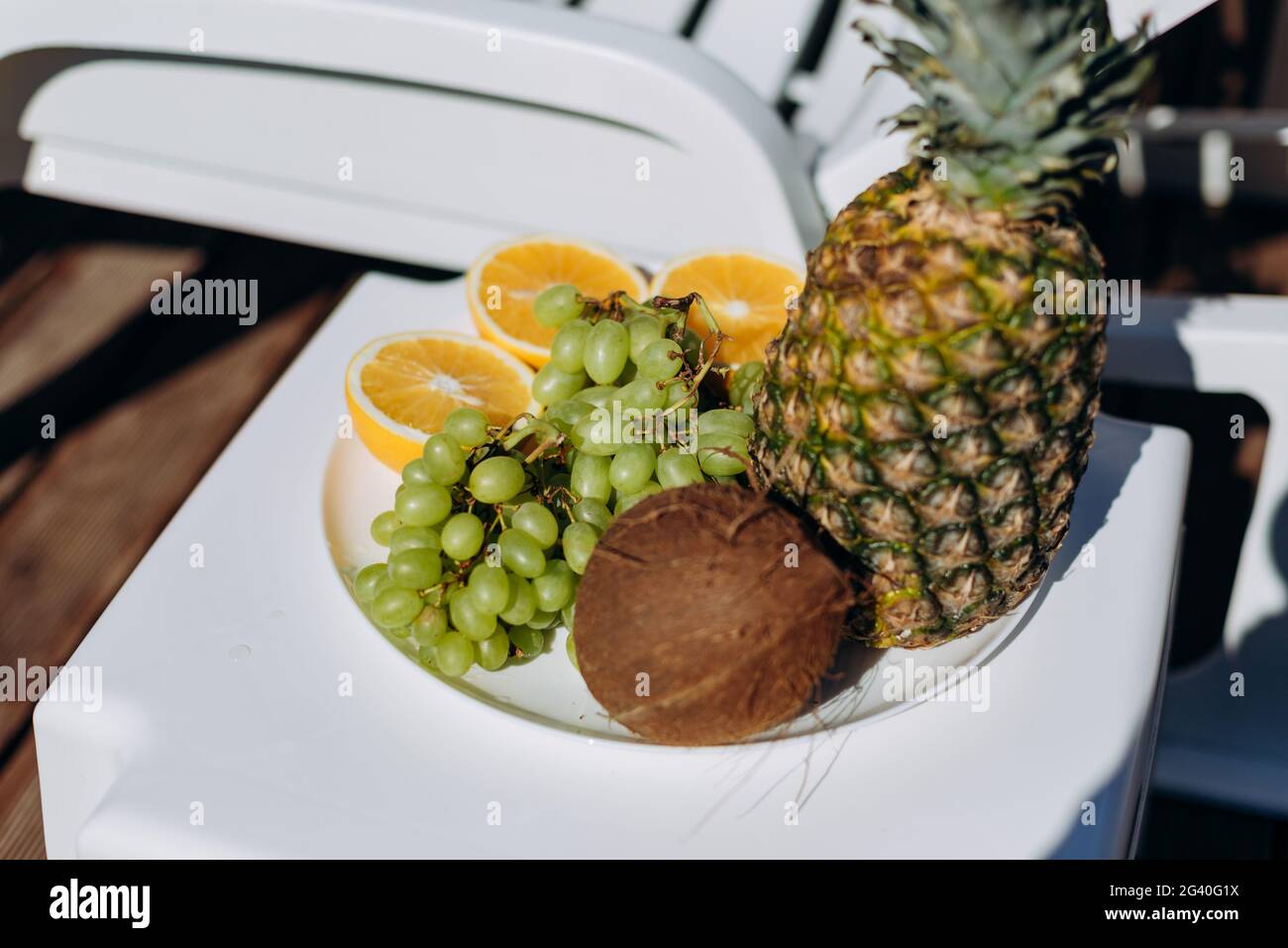 Fresh fruits in soft focus on tray near swimming pool, welcome fruit ...