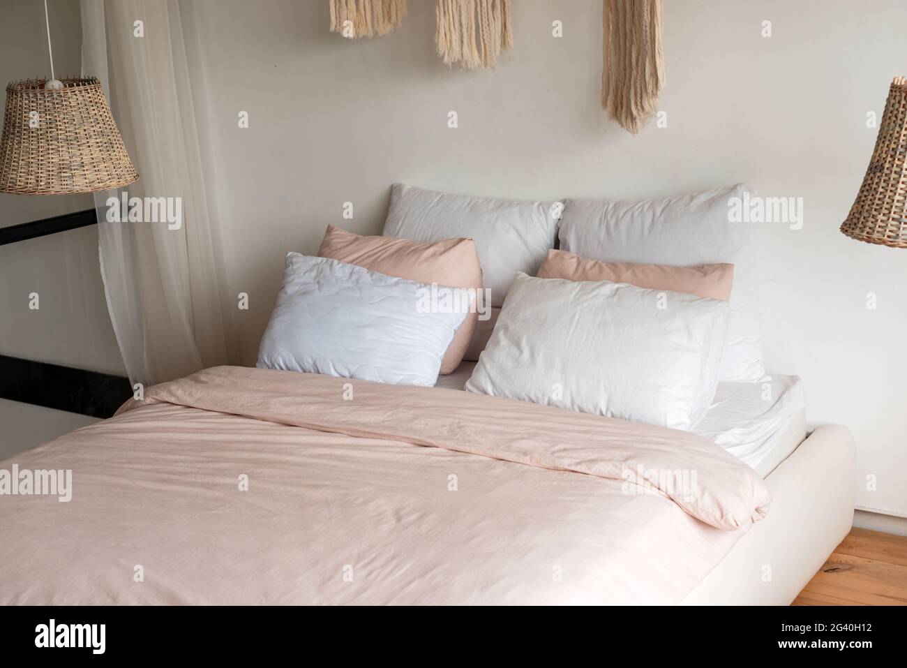 Beautiful bed with beautiful soft linen Stock Photo - Alamy