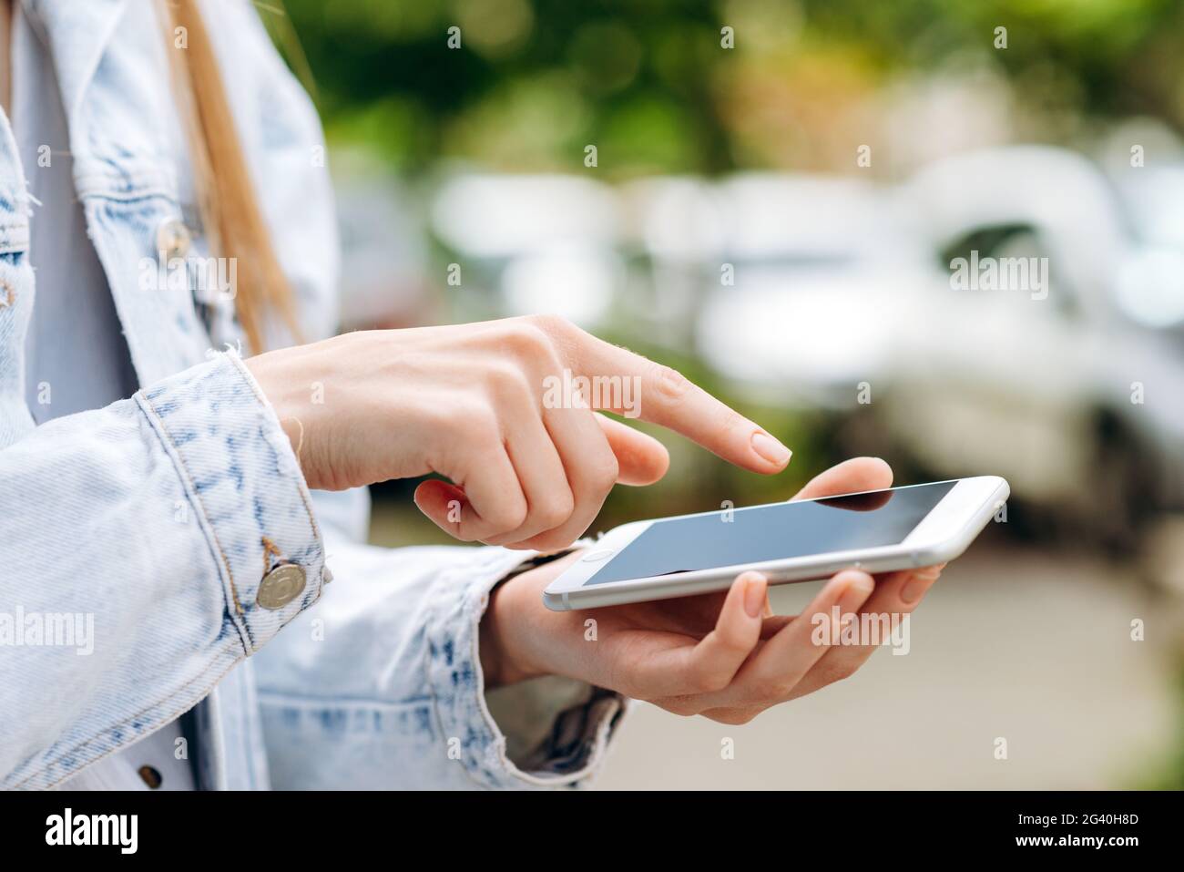 Modern smartphone holding female hands and touching screen Stock Photo ...