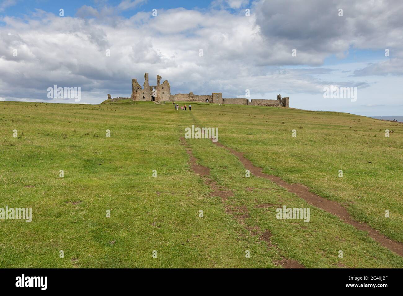 Dunstanburgh castle people hi-res stock photography and images - Alamy