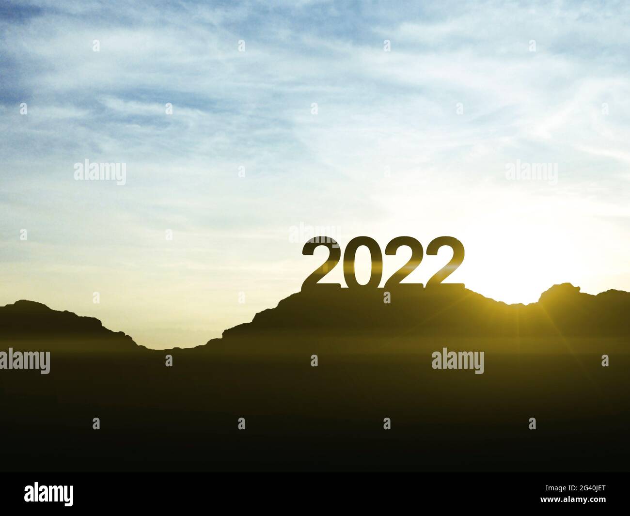 2022 happy new year sign on top of the mountain with sunset, symbol of ...