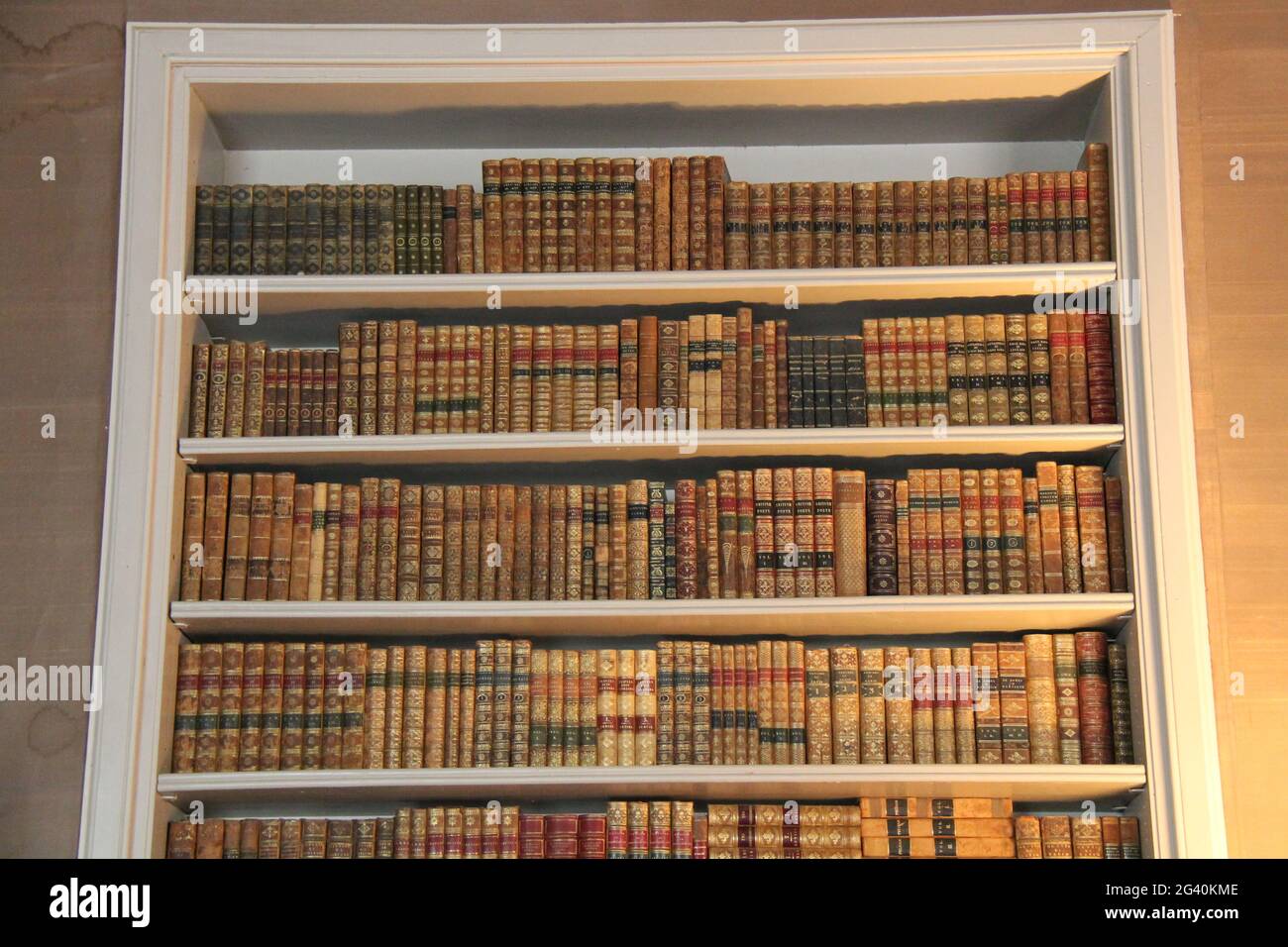 A Collection of Vintage Books in an Alcove Bookcase Stock Photo - Alamy