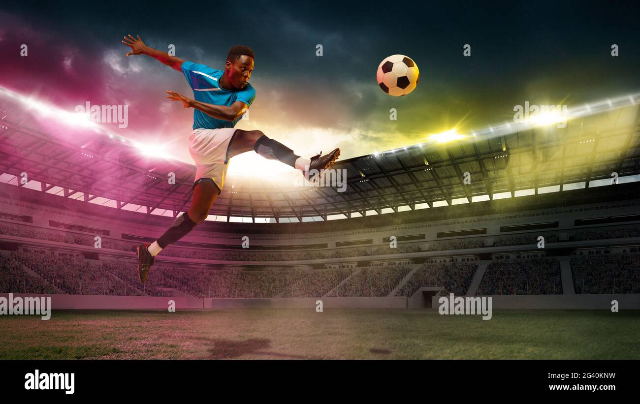 Goal. Male african socce, football player jumping in attack during ...