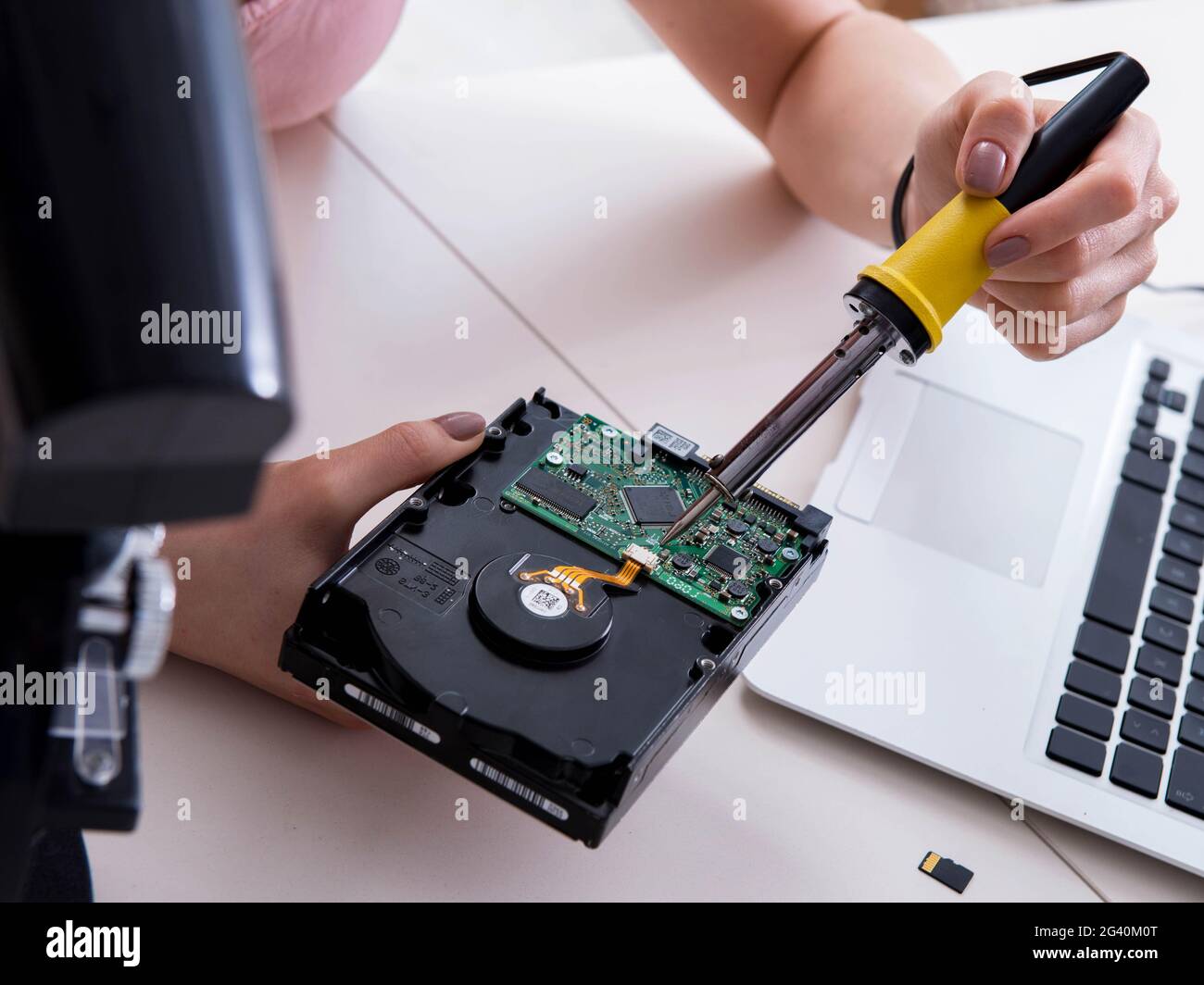 Hard drive repair and data recovery with restoration Stock Photo - Alamy