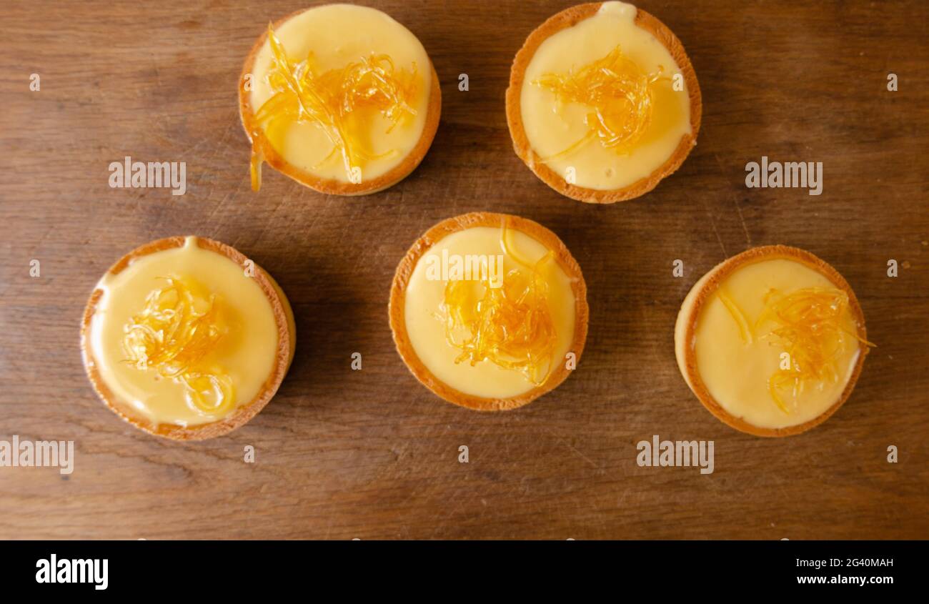 Top view of tarts with delicious yellow filling and syrup Stock Photo ...