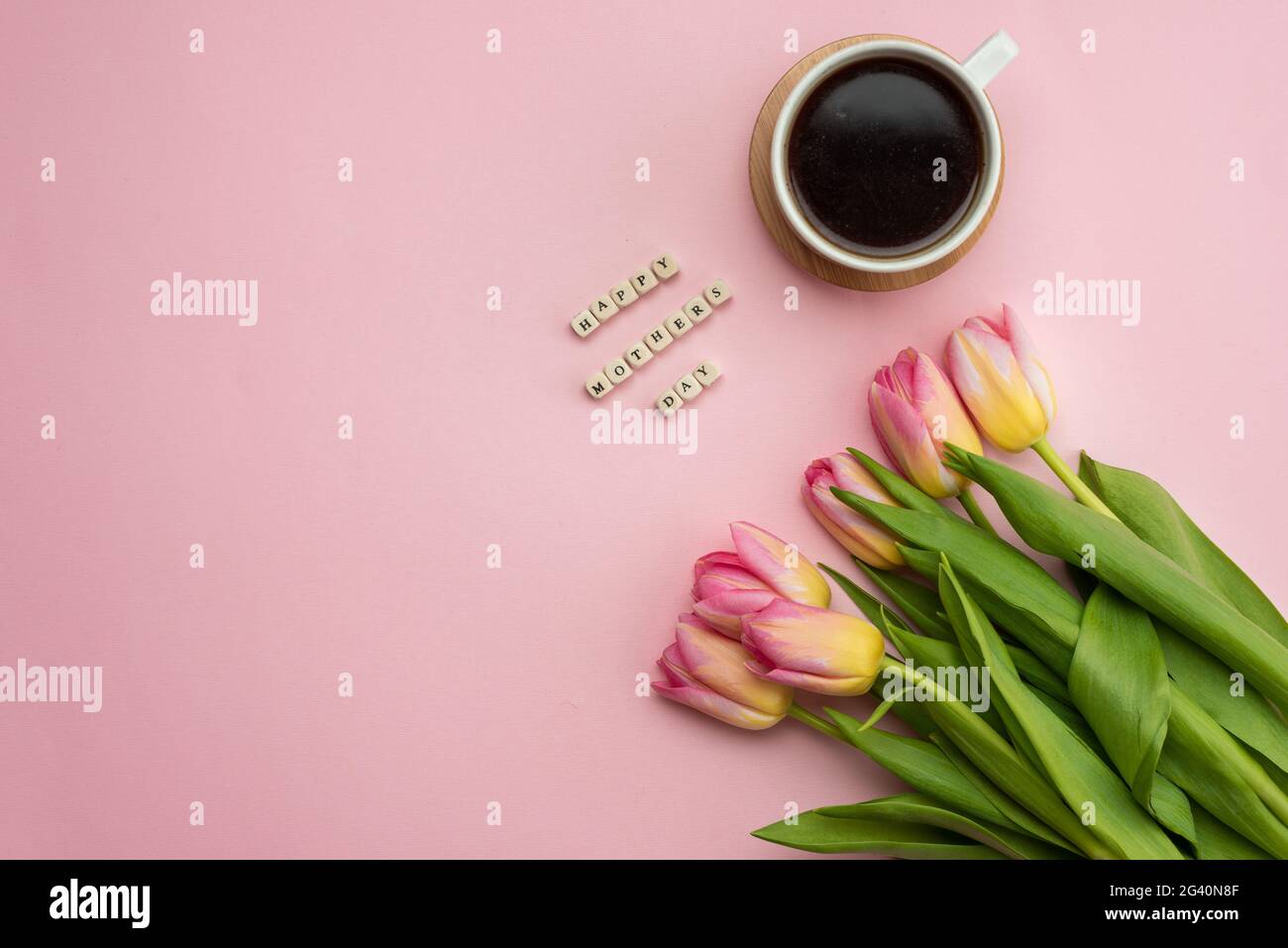 Happy Mothers Day Concept Bouquet Of Pink Tulips On Pink Background Top