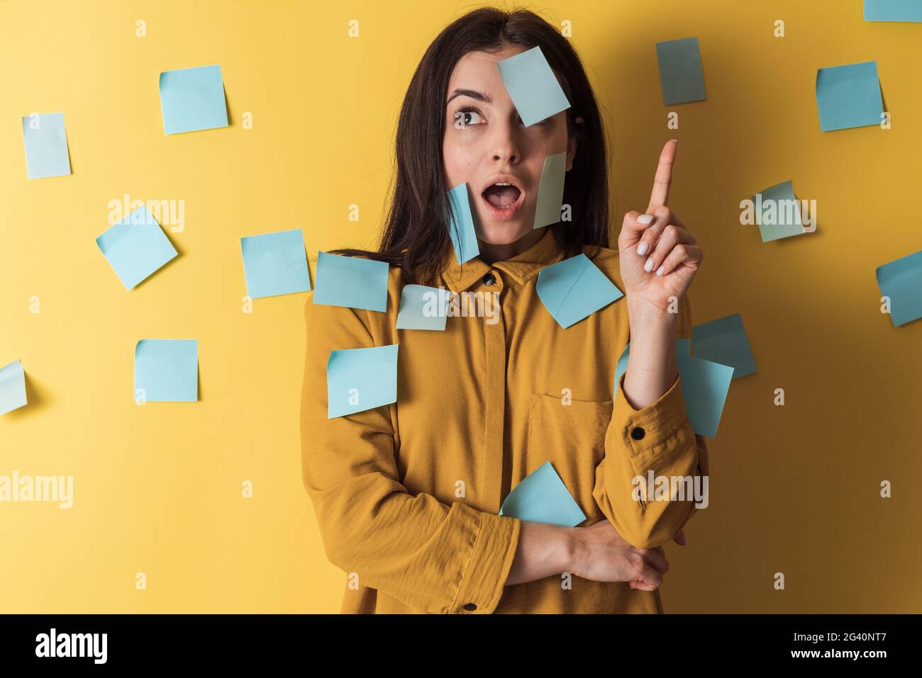 Charming girl with stickers on her face isolated on orange background ...