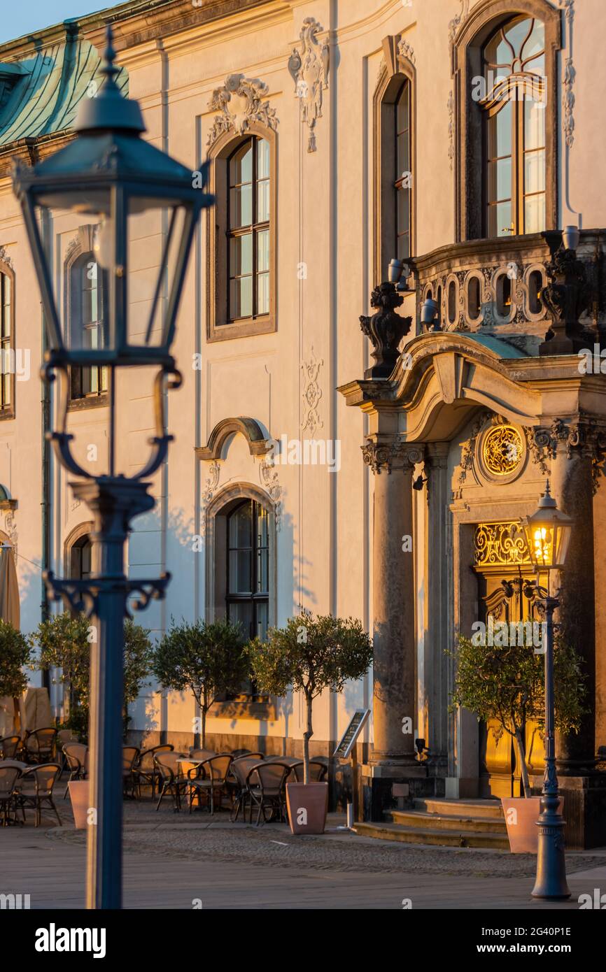 Vertical shot of a fancy old house with golden doors in the streets of ...