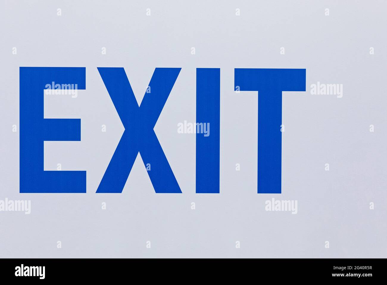Blue Exit Sign Letters at White Background Stock Photo - Alamy