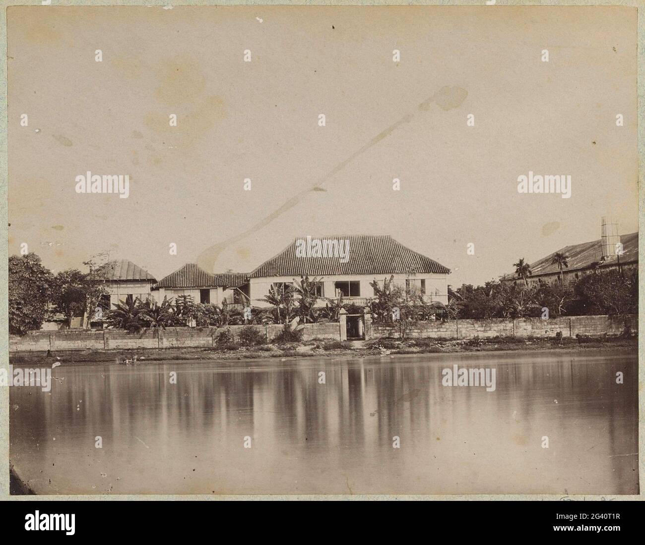 House on a lake, presumably on the Philippines. Part of photo album ...