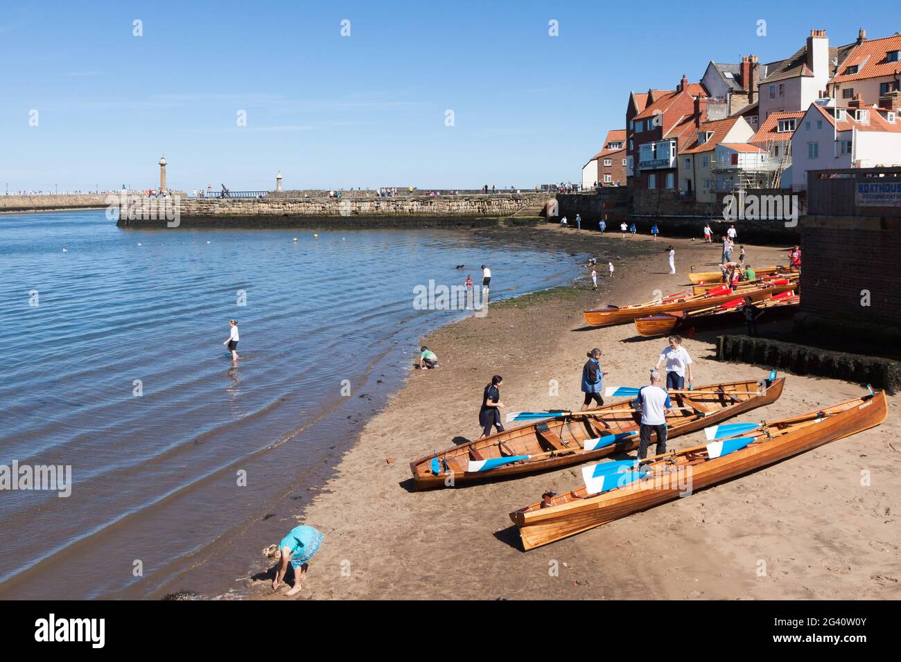 Rowing boats beached on the sand at Whitby Stock Photo - Alamy