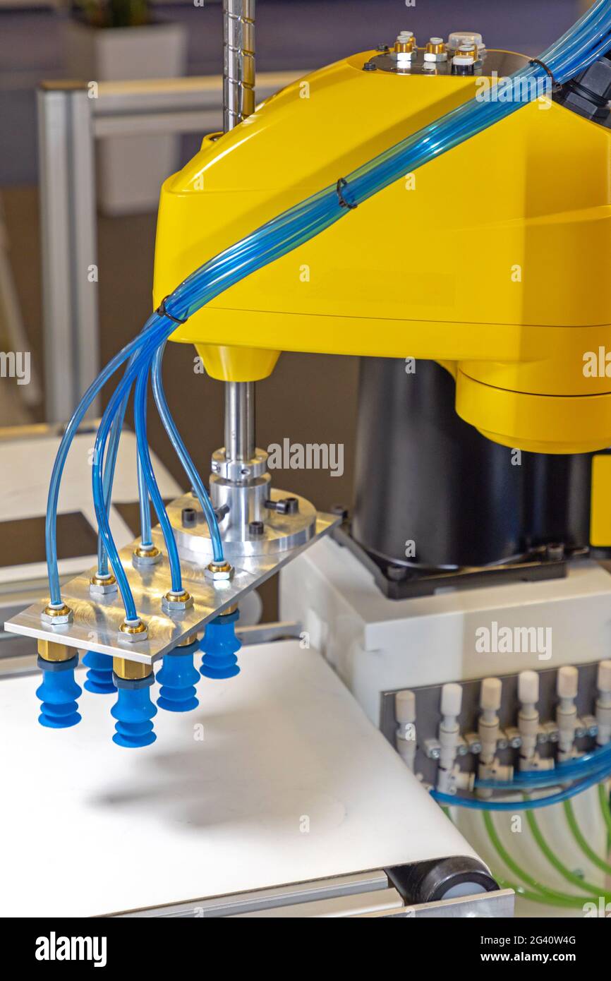Automated Robotic Arm With Vacuum Suction at Conveyor Belt Stock Photo ...