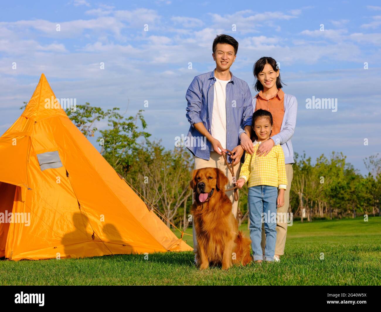 Happy family of three and pet dog in the park high quality photo Stock ...