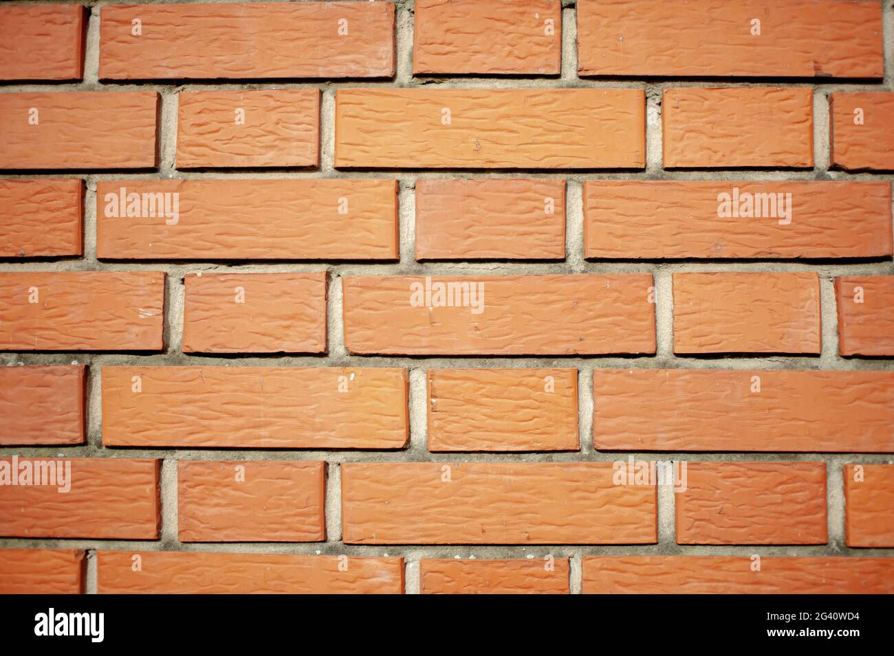 The texture of the facade is made of baked bricks painted in the strong ...