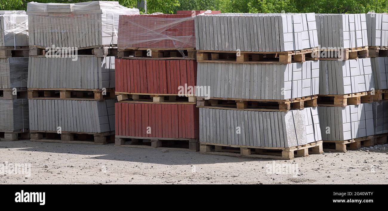stacks of paving slabs on pallets in storage outdoors Stock Photo - Alamy