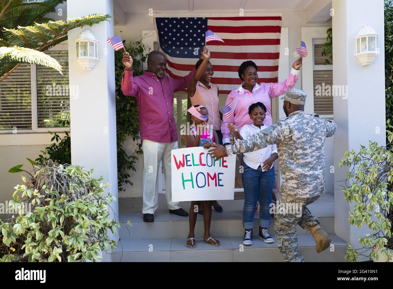 African american soldier father greeting his happy three generation ...