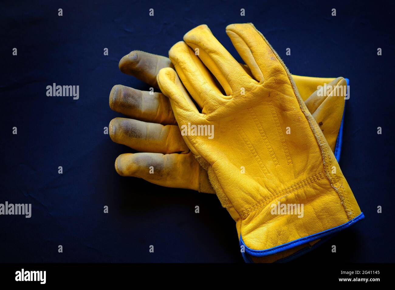 Detail of old worn leather work gloves workgloves texture Stock Photo ...