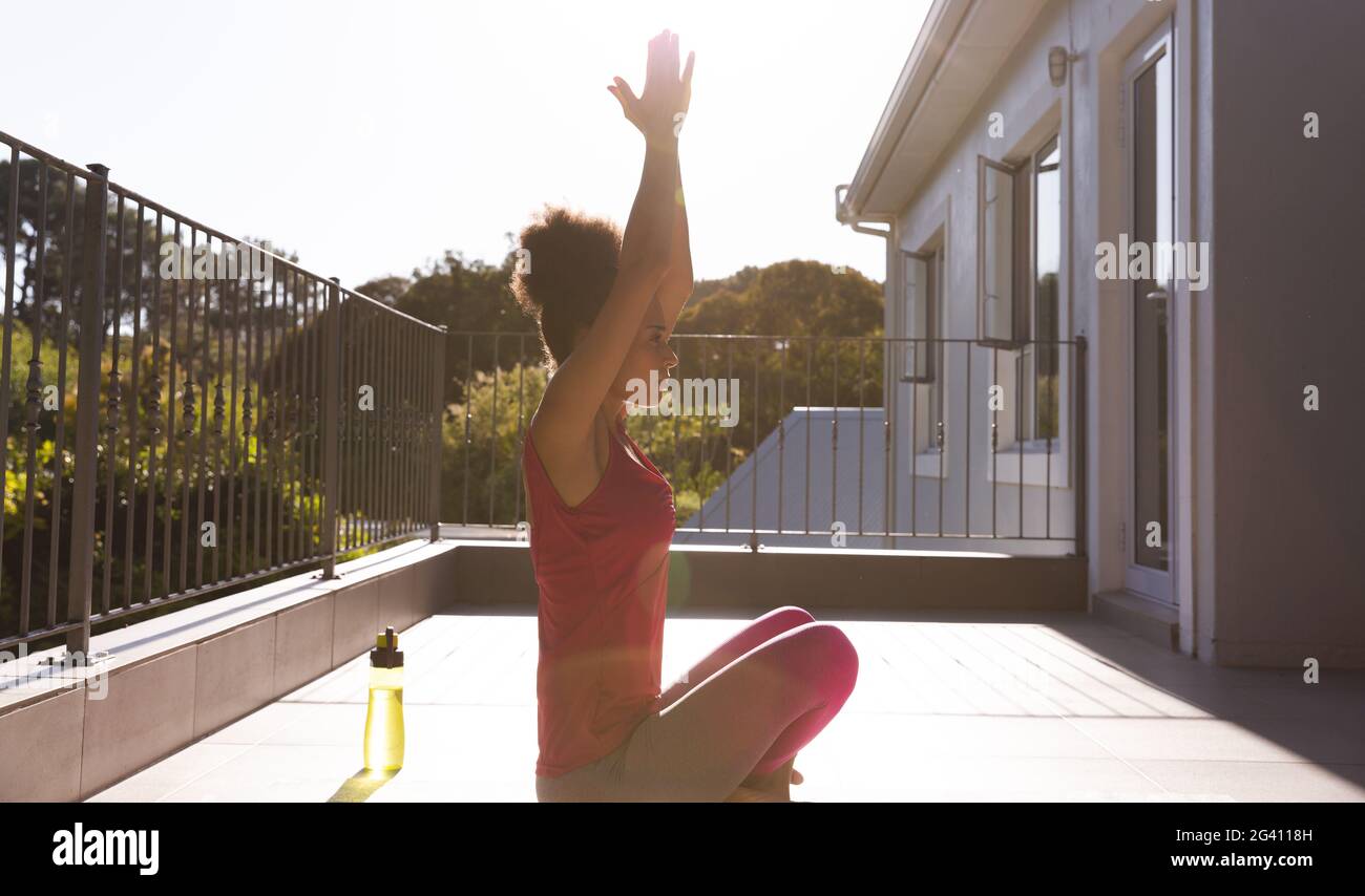 Young woman stretching on terrace hi-res stock photography and images ...