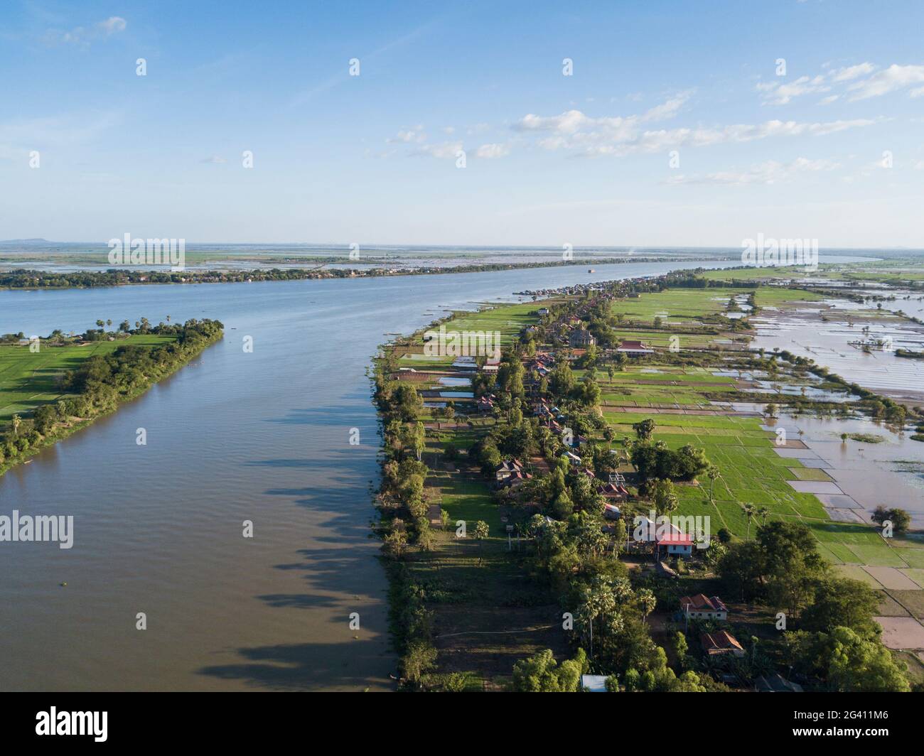 Aerial view of Tonle Sap River, village and rice fields, Kampong Prasat ...