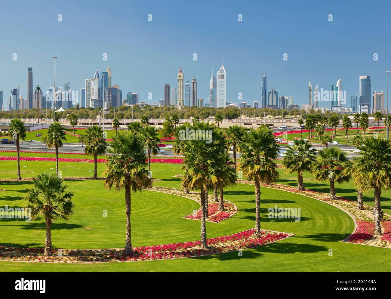 Skyline, green WIese, palm trees, flowers, Dubai, United Arab Emirates ...