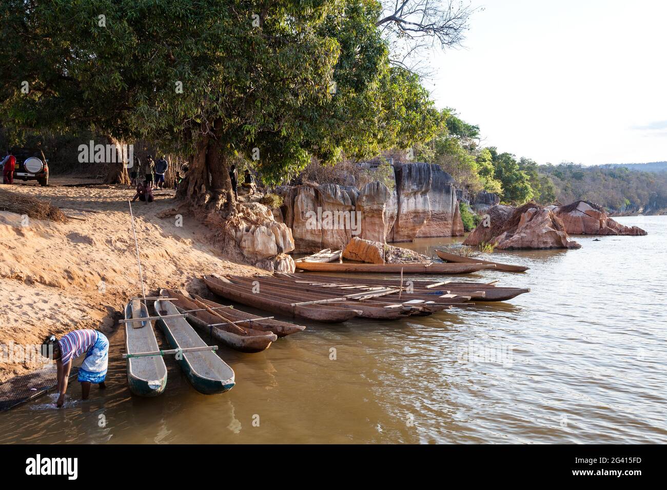 People and boats on the Manambolo River, Tsingy-de-Bemaraha National ...