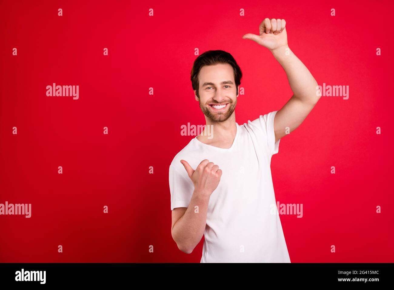 Photo of impressed young brown hairdo man show thumb up point wear ...