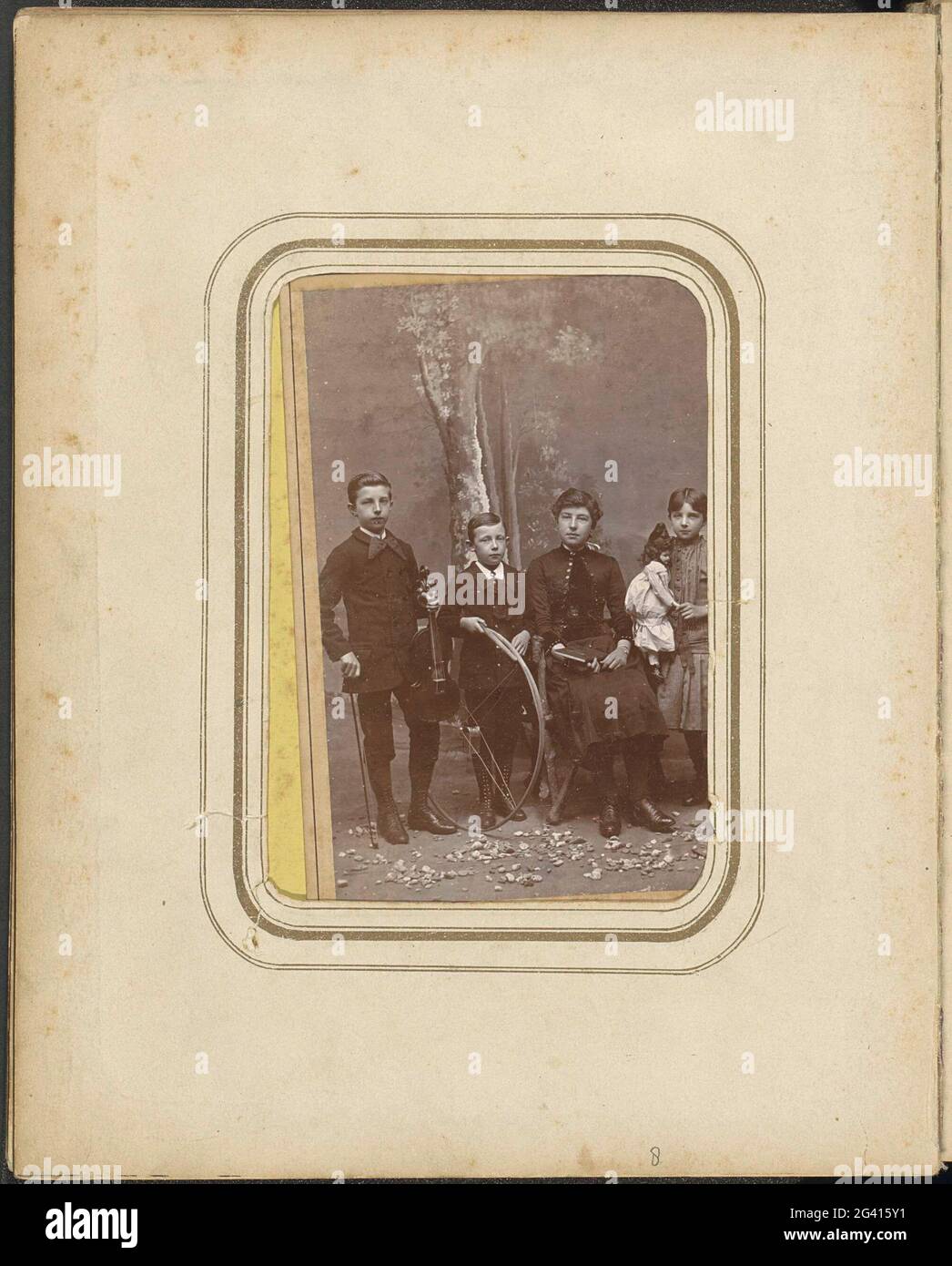 Portrait of a woman with three children. Part of family album from H.W ...