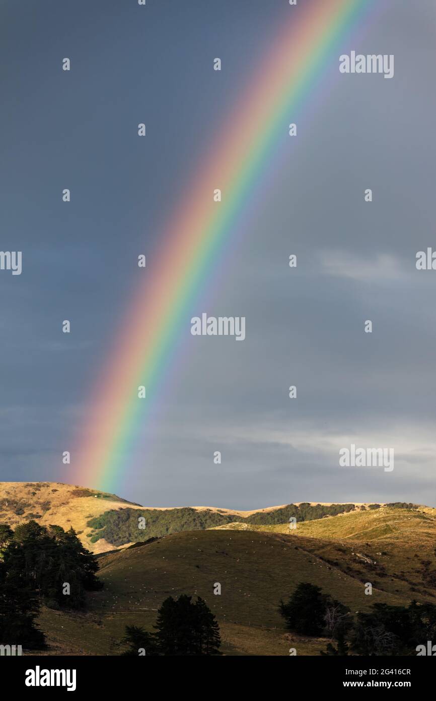 Rainbow over fields trees hi-res stock photography and images - Alamy