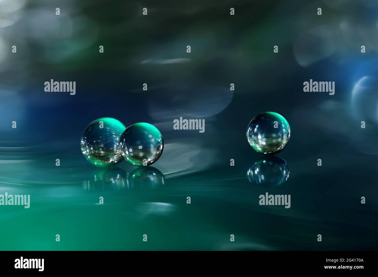 Big water drops, 3d balls on a blurry background with light effects and ...