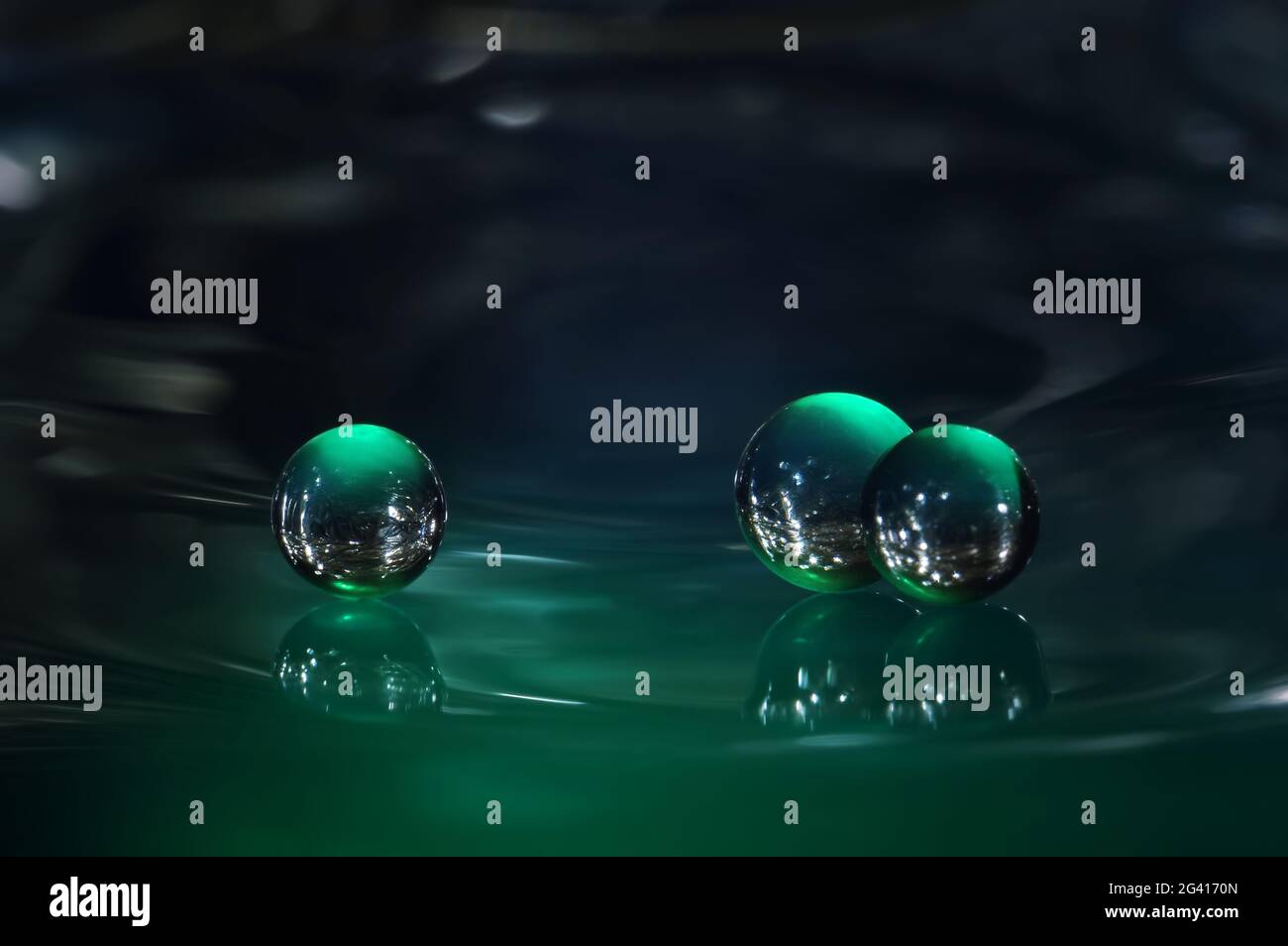 Big water drops, 3d balls on a blurry background with light effects and ...