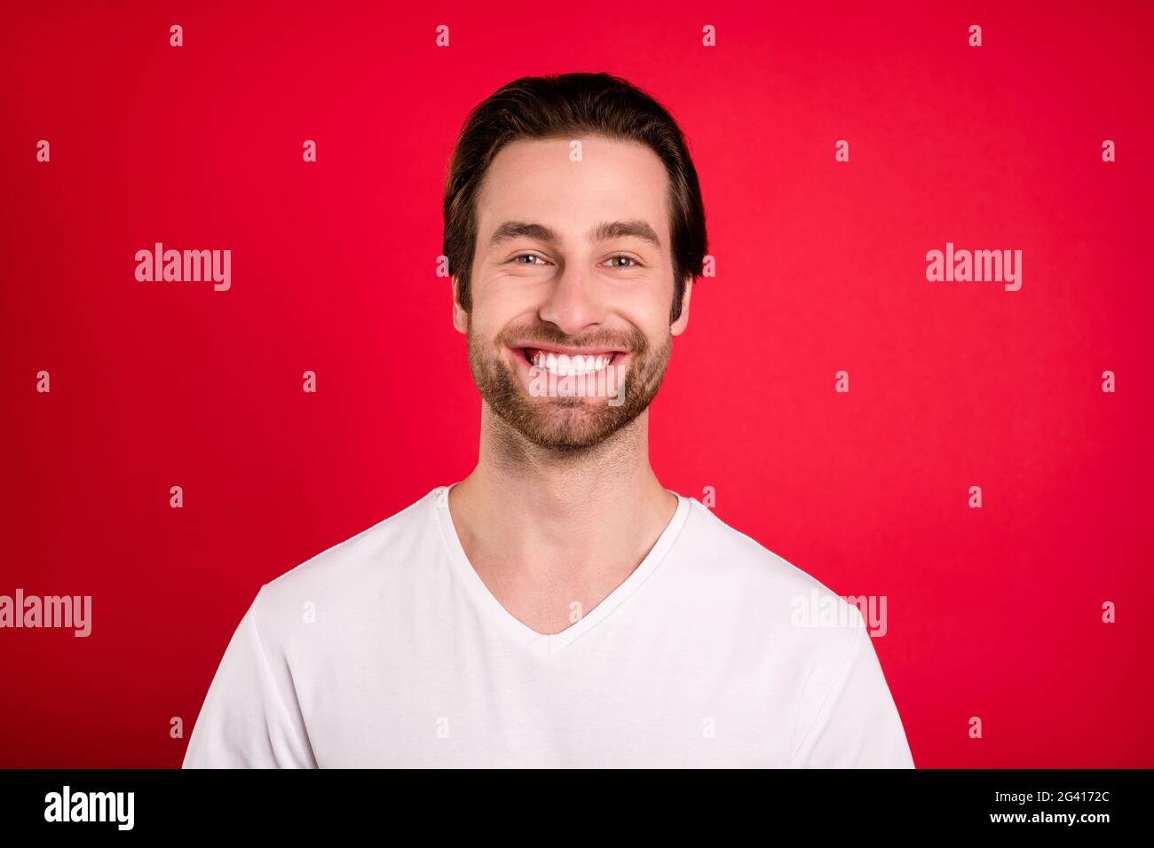 Photo of charming young cheerful happy man smile good mood wear white ...