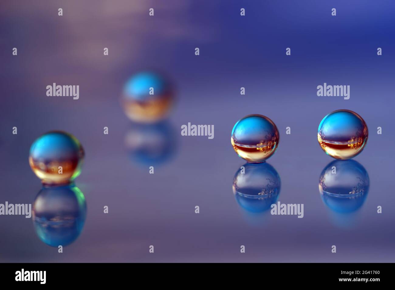 Big water drops, 3d balls on a blurry background with light effects and ...