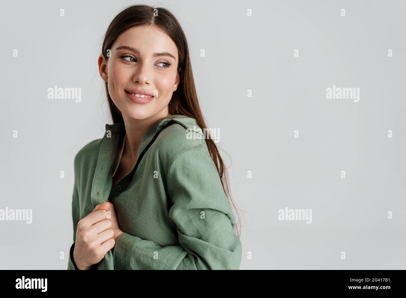 Happy caucasian beautiful girl smiling and looking aside isolated over ...