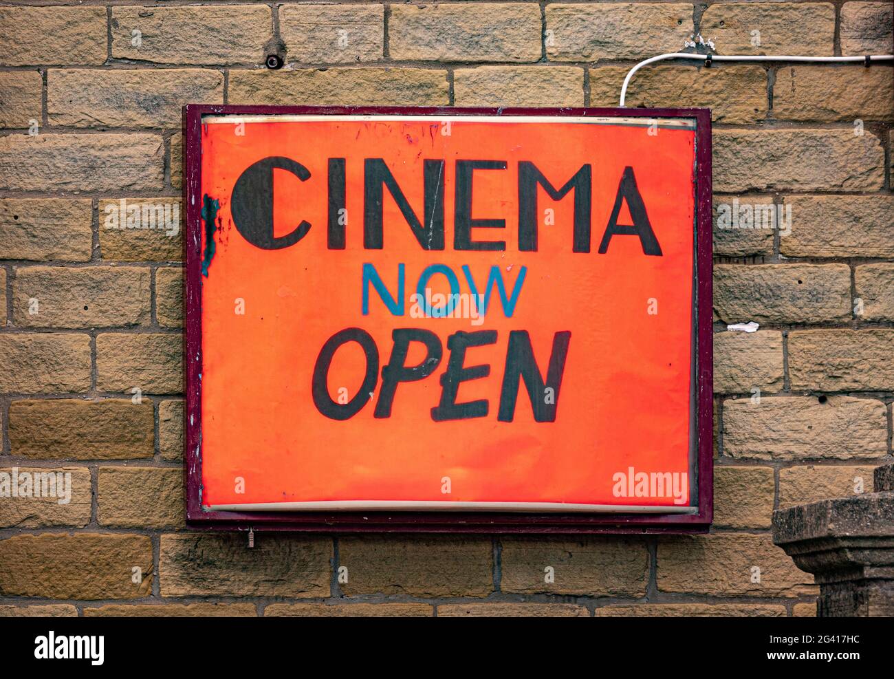 Cinema now open sign Stock Photo - Alamy