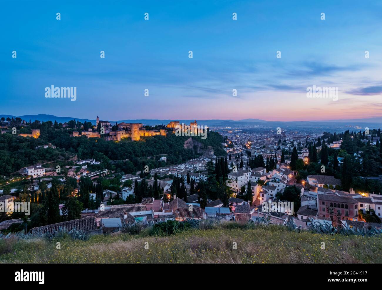 Cityscape with elevated view of Alhambra, dusk, Granada, Andalusia ...