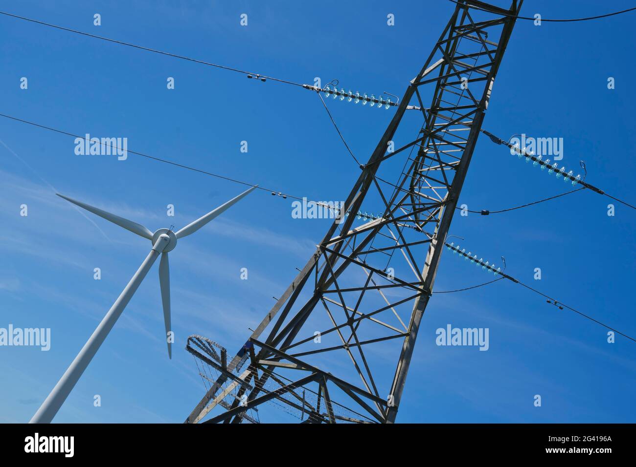Wind turbine and electricity pylons in Powys,Wales,UK Stock Photo - Alamy