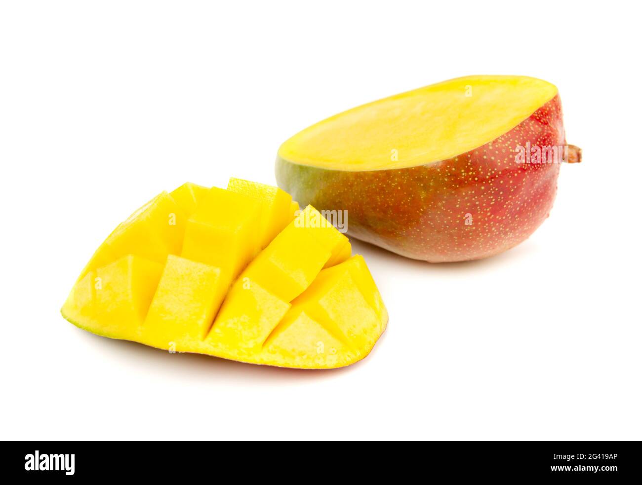 Closeup ripe mango fruit slice with green leaves isolated on white ...