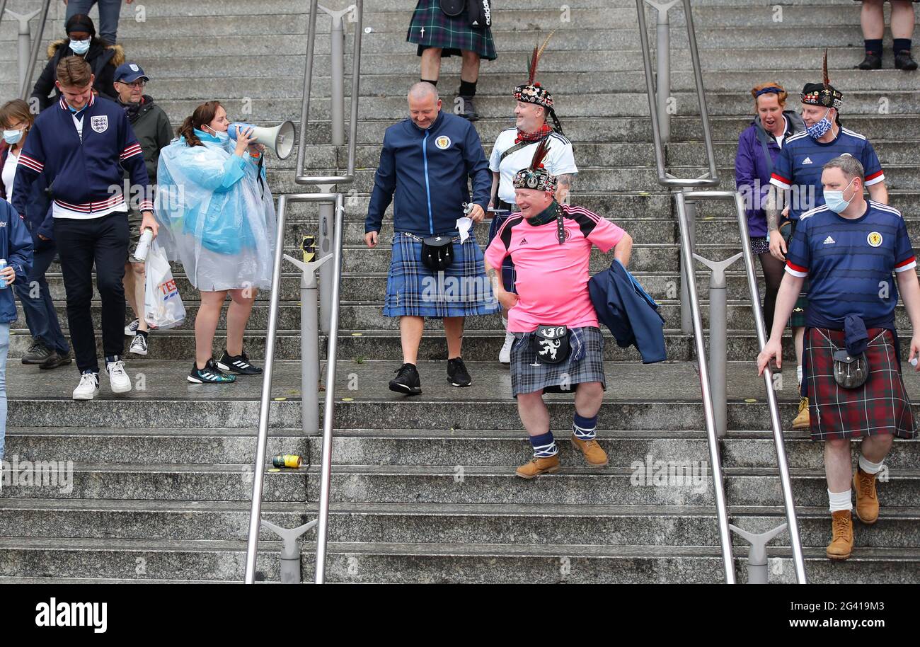 London, UK. 18th June 2021. A fans ambassador welcomes Scotland fans ...
